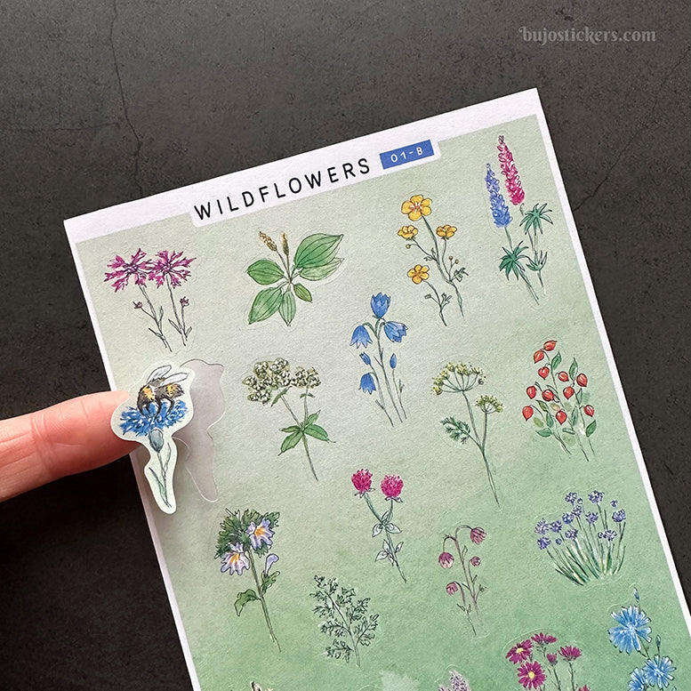 Wildflowers stickers on green background. – bujostickers